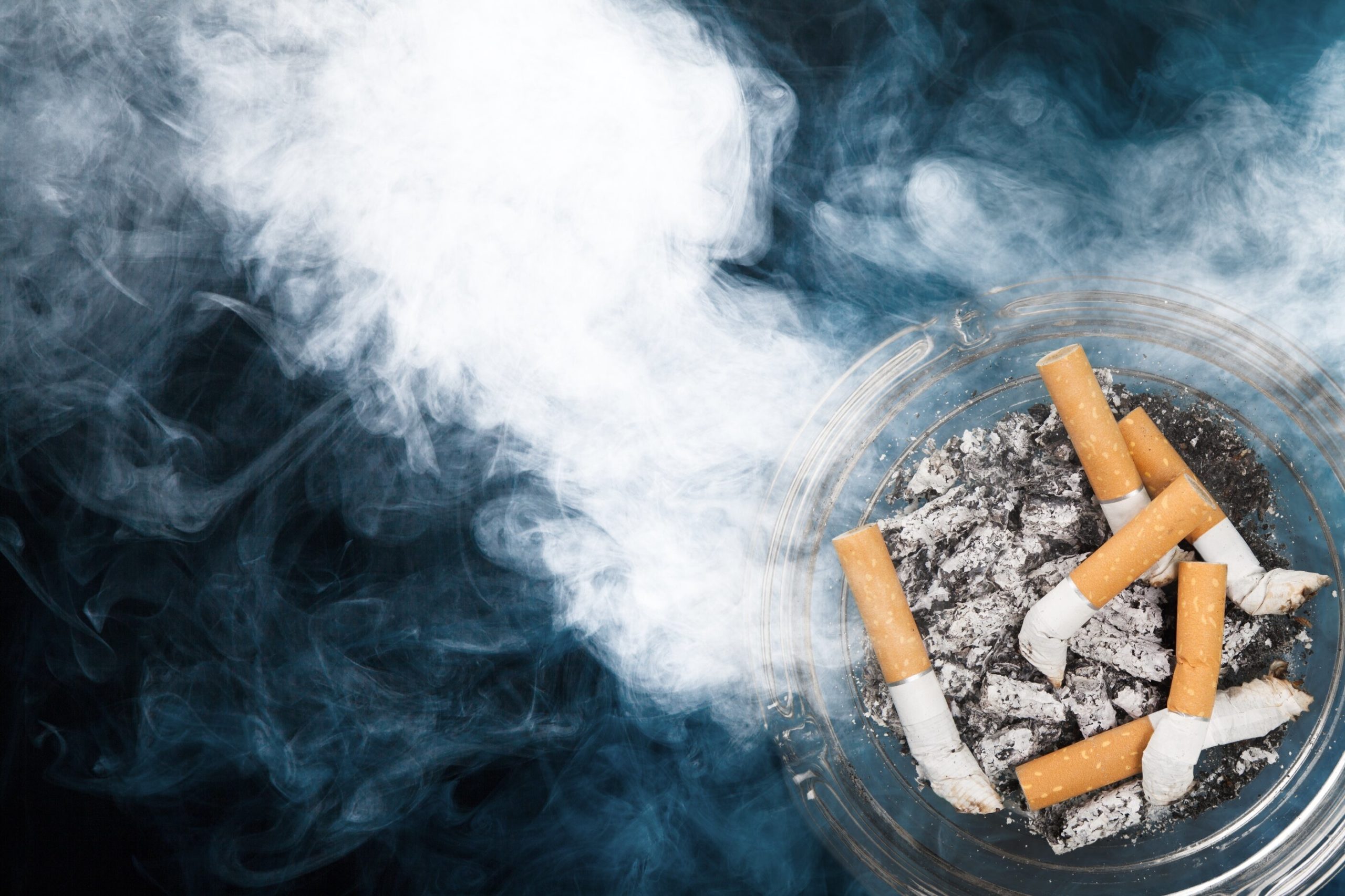 Ashtray and smoked cigarettes with smoke - Sleep Better Florida Blog